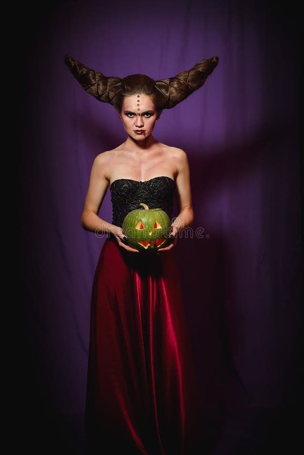 Woman in Halloween Makeup with Hairstyle in Form of Horns, Devil Queen ...