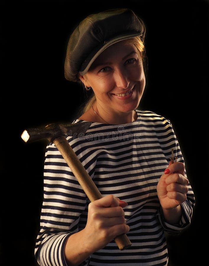 The woman with a hammer stock photo. Image of hang, bolt - 78850910