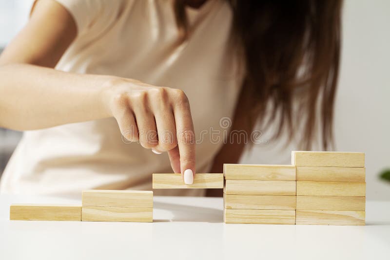 Woman Hand Arranging Wood Cube Stacking As Stair Step Shape Stock Photo ...