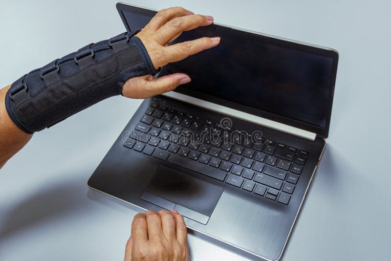 Woman Hand in Black Orthosis is Closes Computer after Work Stock Image ...
