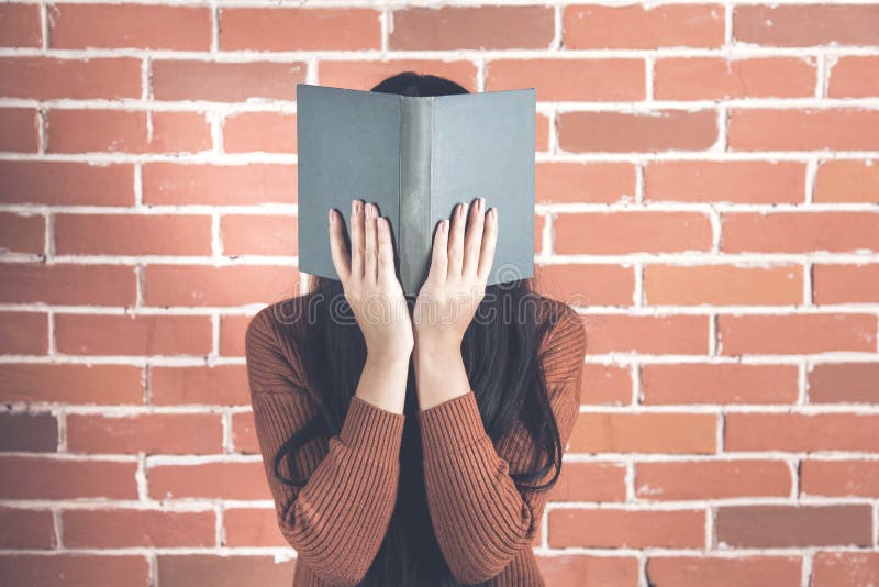 Book in her face stock photo. Image of happiness, school - 4313436