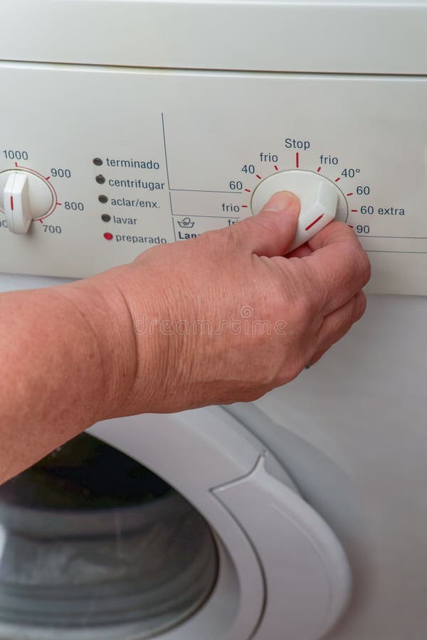 Woman Sets the Washing Program for the Washing Machine. Stock Photo ...