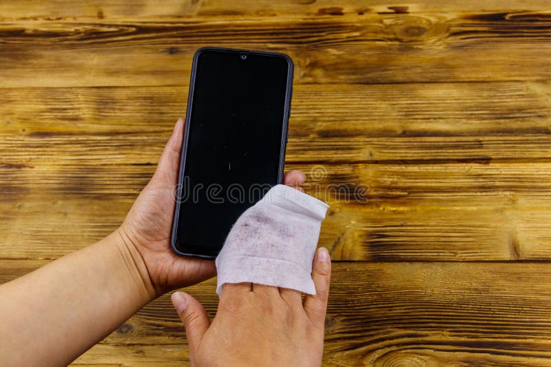 Woman Hand Cleaning Smartphone Screen with Wet Wipe Stock Photo - Image ...