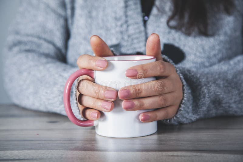 Woman hand cup of coffee stock image. Image of concept - 179384017