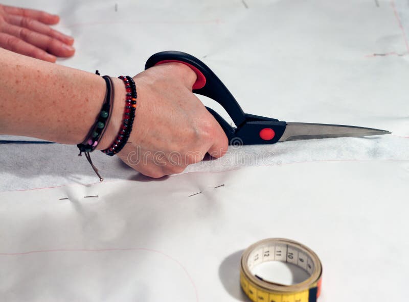 Woman hand cutting fabric stock image. Image of design - 21689107