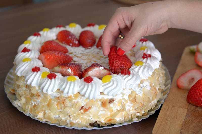 Woman Hand is Decorating a Cream Cake with Strawberries Stock Photo ...