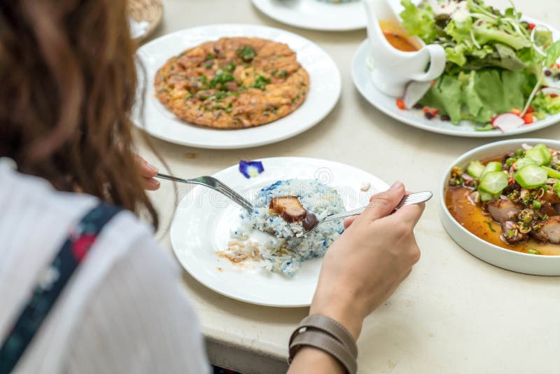 Woman hand eating rice stock image. Image of concept - 127038133