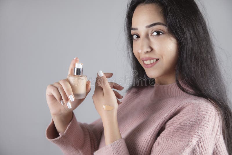 Woman hand foundation stock photo. Image of professional - 208844788