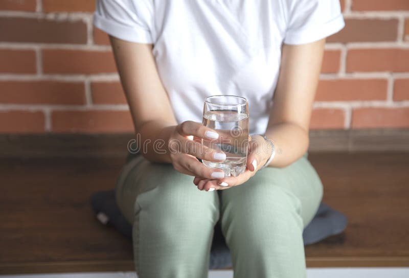 Woman hand glass of water stock photo. Image of white - 201671356