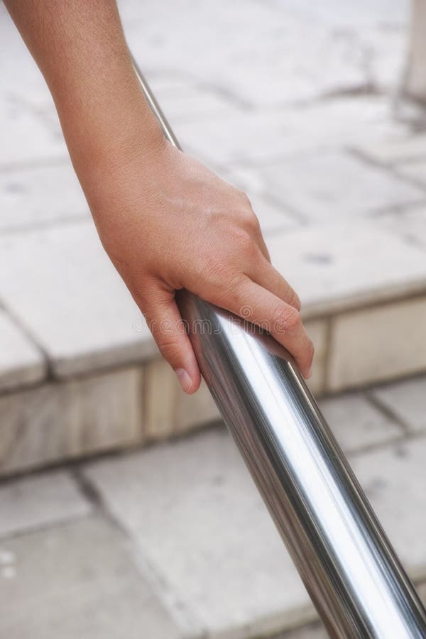 Woman hand on handrail stock photo. Image of upstairs - 61610644