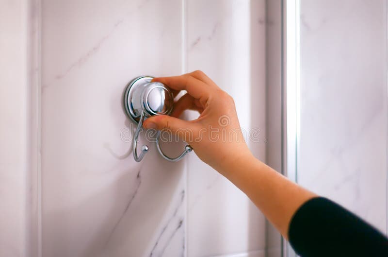 Woman Hand with Hanger in Bathroom Stock Photo - Image of hanger ...