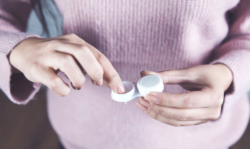 Woman hand holding lenses stock image. Image of lenses - 172343555