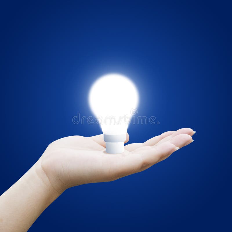 Hand holding light bulb stock image. Image of shiny, hand - 30165953
