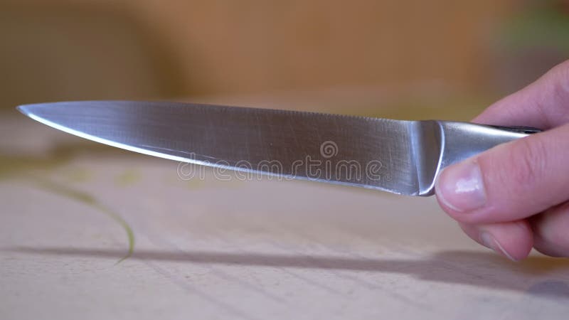 A Woman Hand is Holding a Sharp, Long Kitchen Knife Over Surface of ...