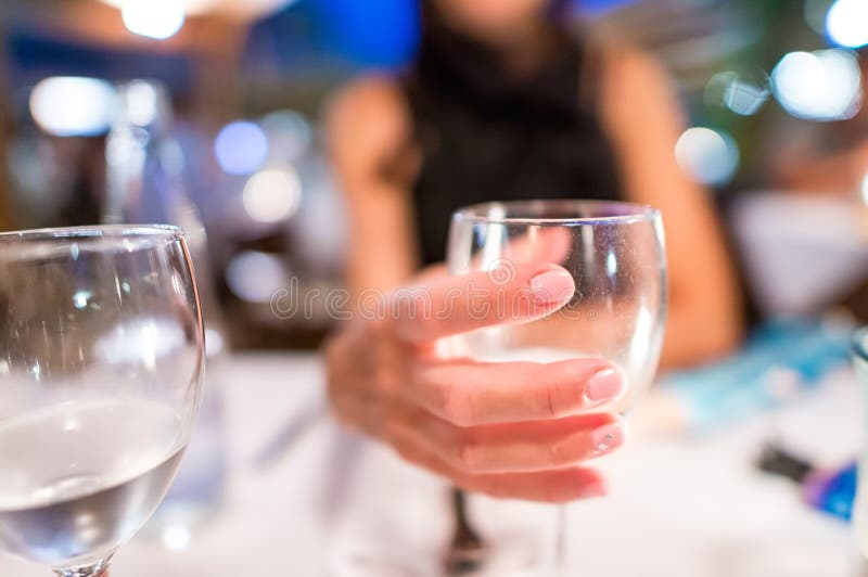 Woman Hand Holding Wine Glass at Restaurant Stock Photo - Image of ...