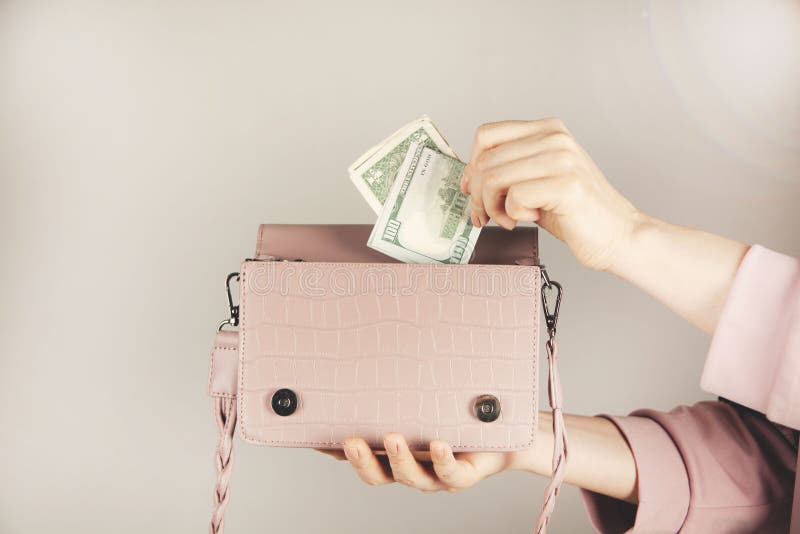 Woman hand money with bag. stock photo. Image of financial - 247213930