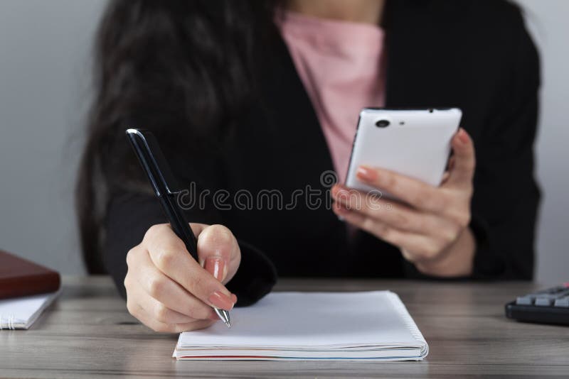 Woman Hand Notepad and Phone on Table Stock Image - Image of list ...