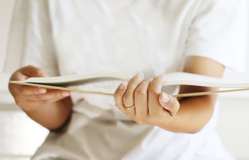 Woman hand open a book stock photo. Image of white, hand - 55951510
