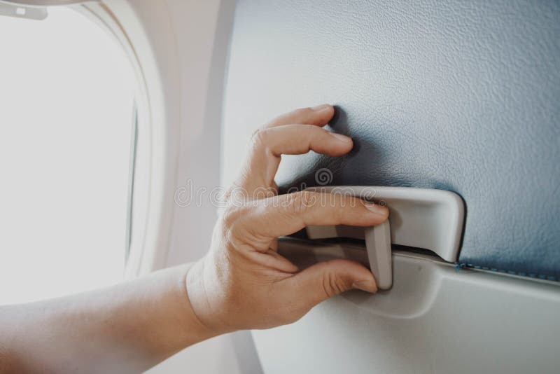 Woman Hand Open Tray at the Seat Back Stock Photo - Image of airplane ...