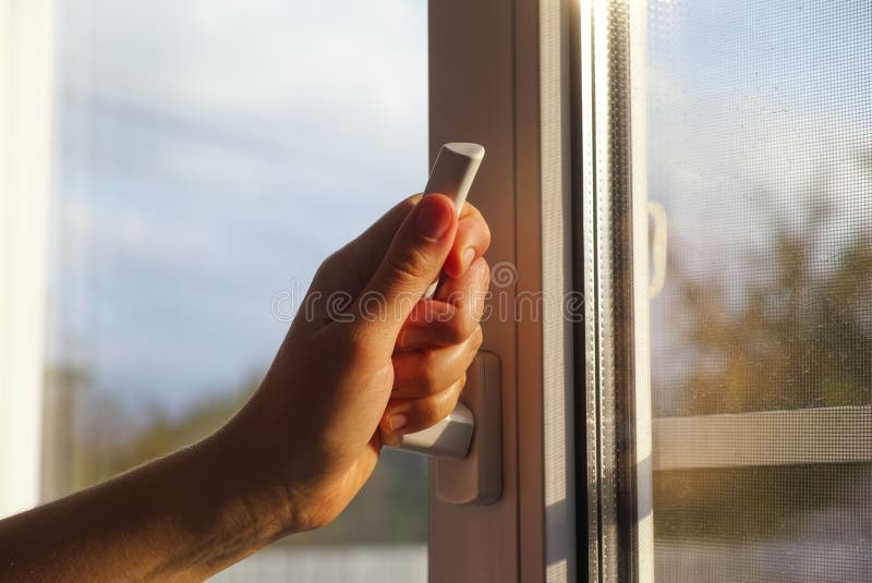 Woman Opening Window Using Handle Stock Photos - Free & Royalty-Free ...