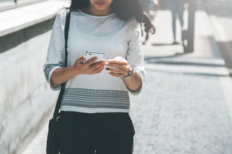 Woman hand phone in street stock image. Image of message - 170089493