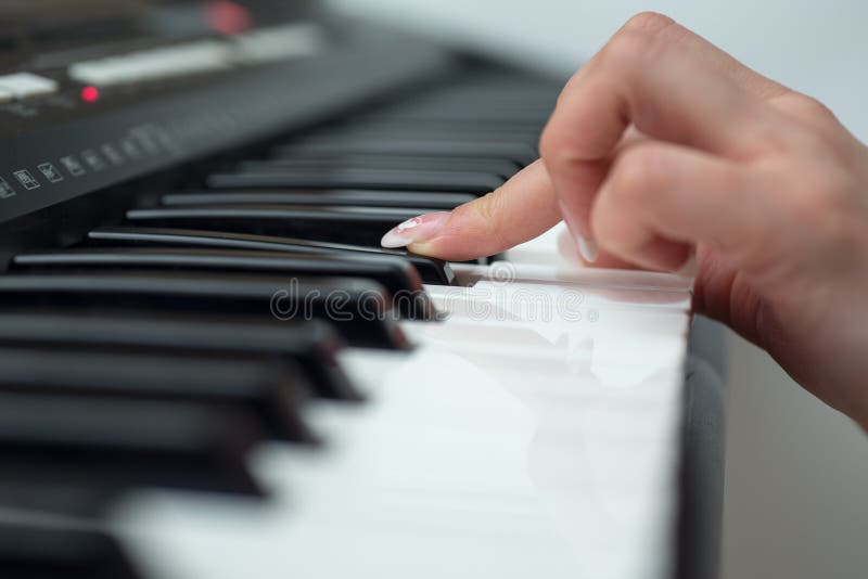 Woman Hand Playing a MIDI Controller Keyboard Synthesizer Close Up ...