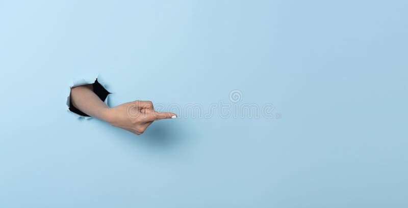 Woman Hand Pointing in the Wall on Blue Banner Copy Space Background ...