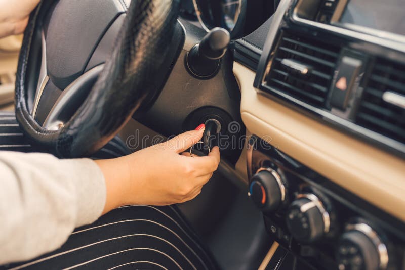 Woman Hand Put Key into the Ignition and Starts the Car Engine Stock ...