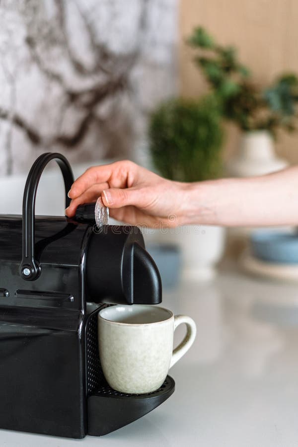 Woman Hand Putting Espresso Capsule To Coffee Machine Stock Photo ...