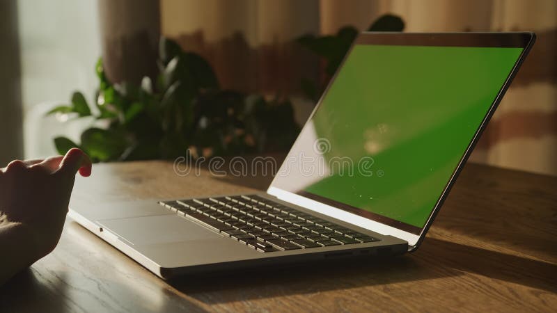 Woman Hand Random Scroll Down on a Laptop Computer Touchpad with Green ...