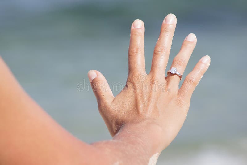 Woman Hand with Ring on the Beach Stock Photo - Image of family ...