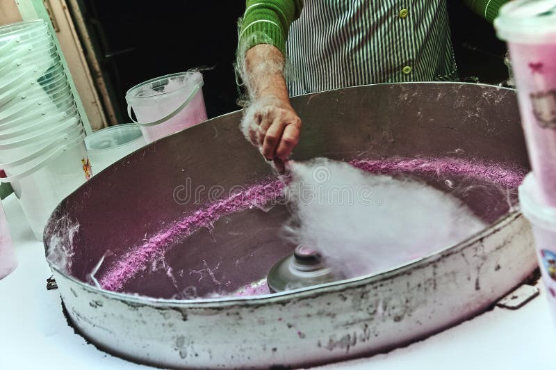 Woman Hand Rolling a Pink Cotton Candy in a Candyfloss Machine. Stock ...