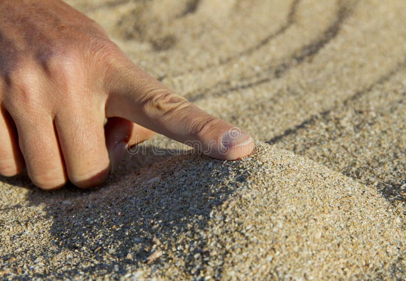 Woman hand and sand. stock photo. Image of caucasian - 39661122