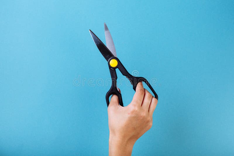 Woman Hand with Scissors. Isolated on Blue Stock Photo - Image of metal ...