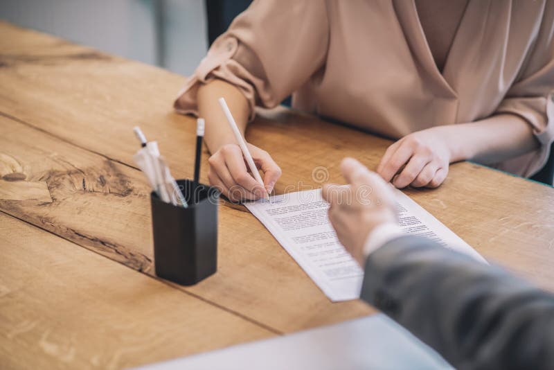 Woman Hand Signing Document and Male Pointing Stock Photo - Image of ...