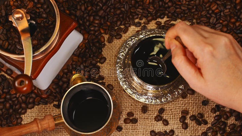 Woman hand stirring coffee stock photo. Image of preparation - 207266422