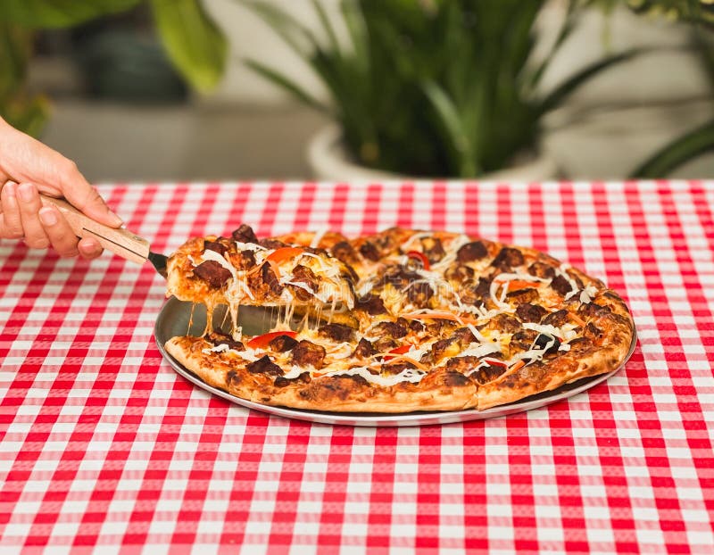 Woman Hand Takes a Slice of Pizza with Spatula on Table. Stock Photo ...