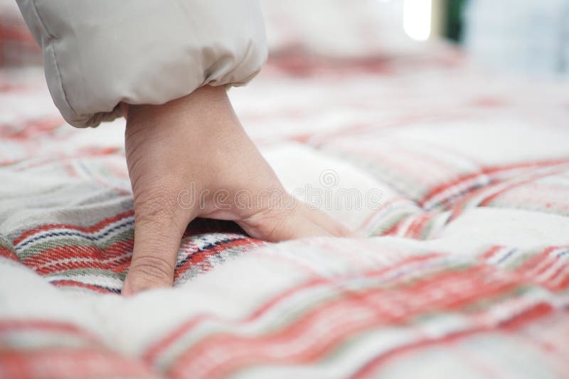 Woman Hand Touching and Pressing Orthopedic Mattress on Bed. Stock ...