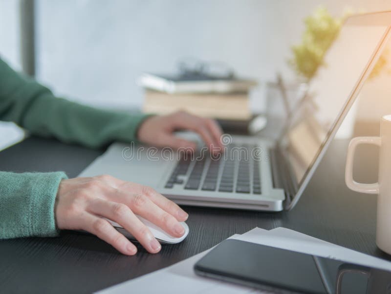 Woman Hand Use a Laptop with Wireless Mouse on Desk at Home Stock Photo ...