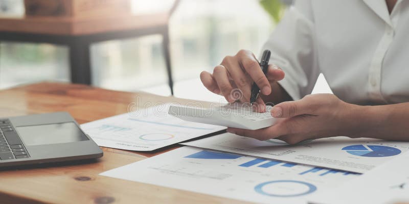 Woman Hand Using Calculator, Working with Graph Chart and Analyzing ...