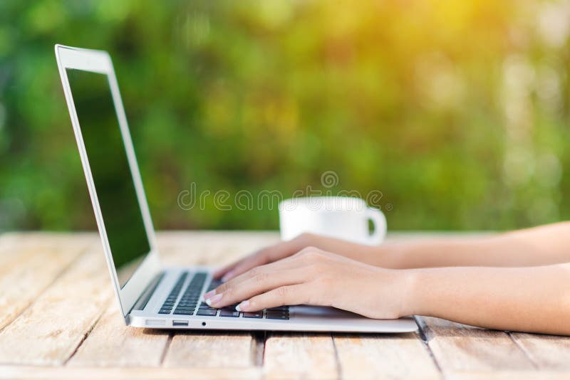 Woman hand using laptop stock photo. Image of coffee - 85174502