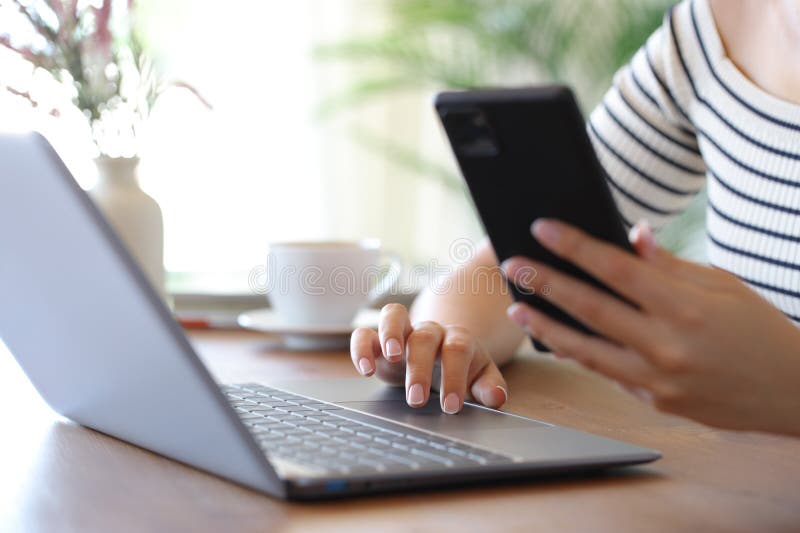 Woman Hand Using Mobile Phone and Laptop on a Table Stock Photo - Image ...