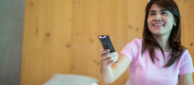 Woman Hand Using Remote Controller for Adjust Smart TV Inside the ...