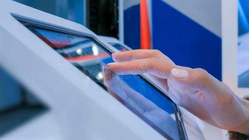 Woman Hand Using Touchscreen Display of Floor Standing White Tablet ...