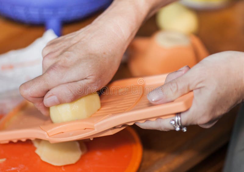 Woman Hand Working on a Potato Grater Stock Photo - Image of food, cook ...