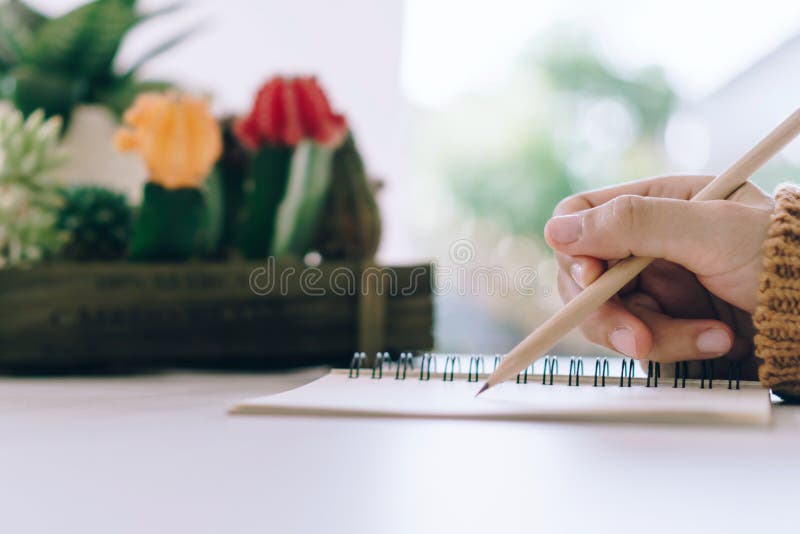 Woman Hand Write Down in White Memo Notebook for Take a Note Not To ...