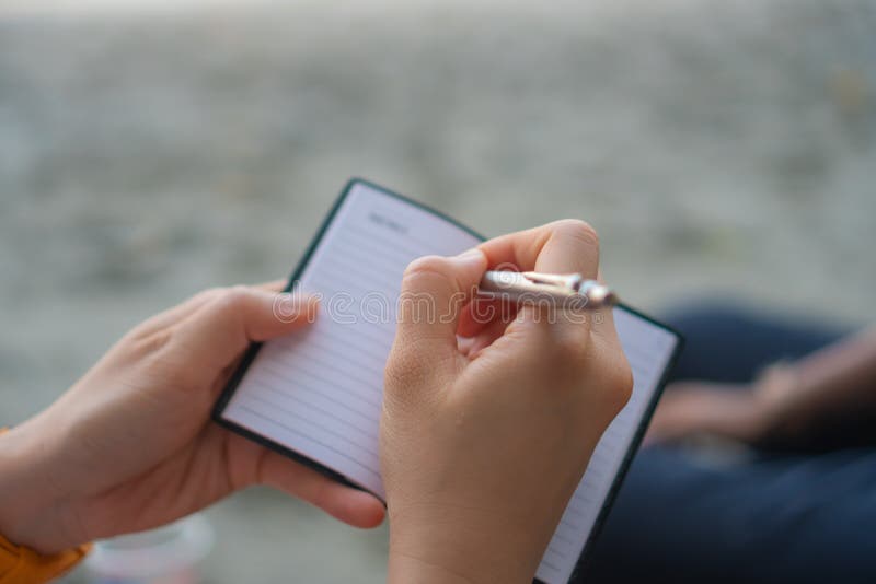 Woman Hand Writing Down in Small White Memo Notebook Stock Image ...