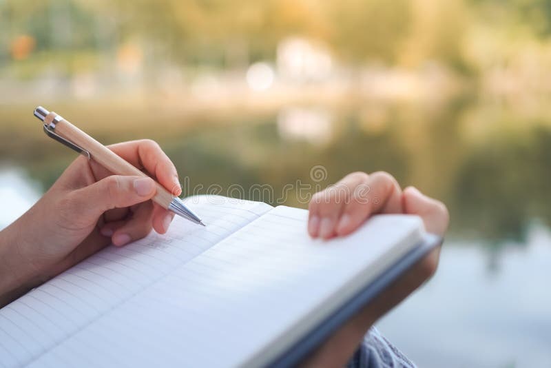 Woman Hand Writing Down in Small White Memo Notebook for Take a Note ...