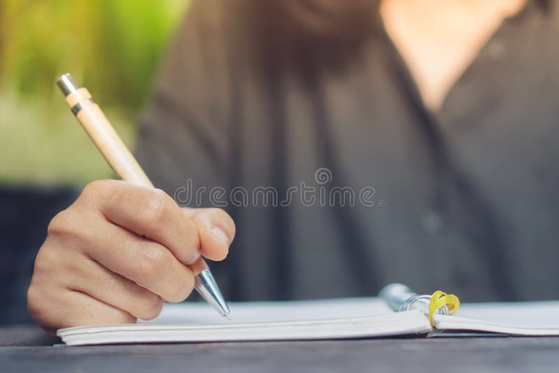 Woman Hand Writing Down in Small White Memo Notebook for Take a Note ...