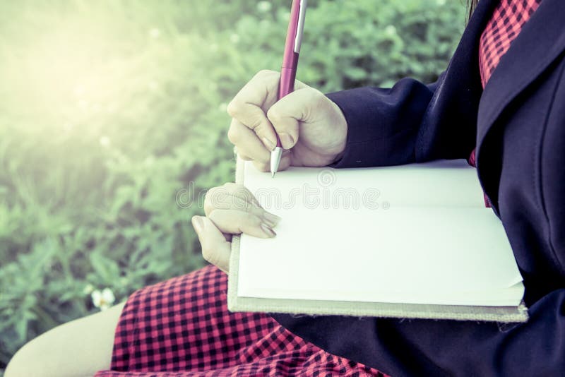 Woman Hand Writing Her Notebook in the Garden Stock Photo - Image of ...